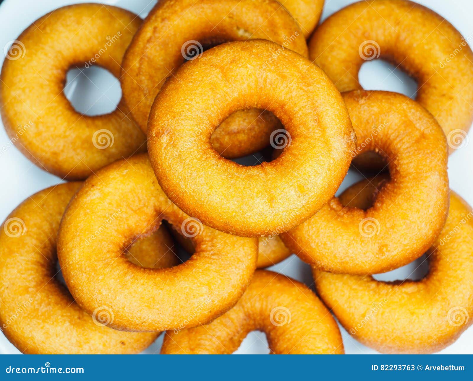 Closeup of a Plate with Freshly Made Brown Doughnuts Stock Image ...