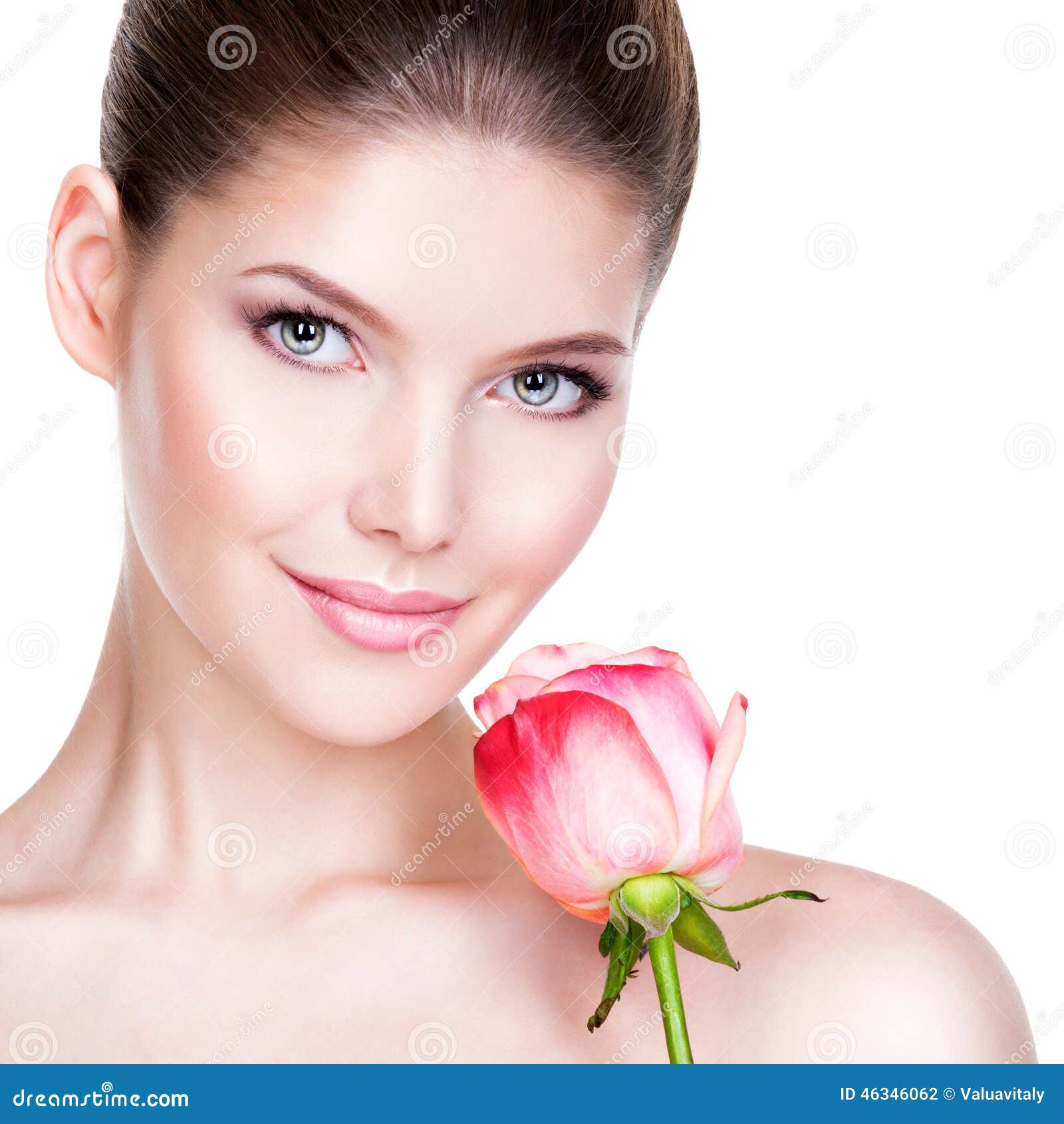 Closeup Portrait Of Beautiful Young Woman With Flower Near Face Stock