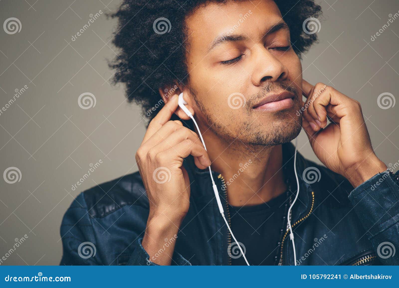 Happy African Man Smiling Listening To Music In Headphones White