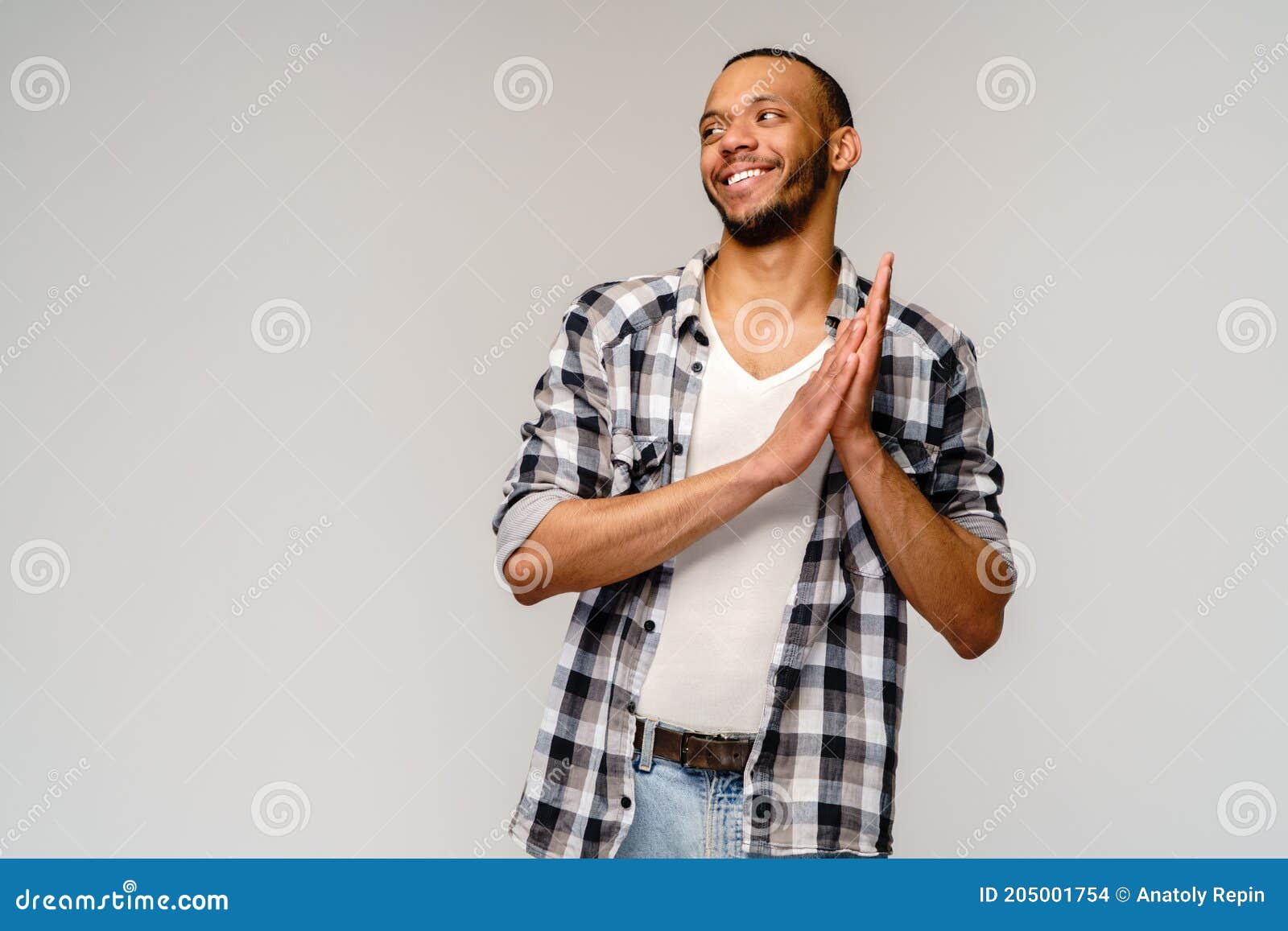 Closeup Portrait Of Happy Young Handsome African-american Man Rubbing ... Closeup Portrait Of Happy Young Handsome African-american Man Rubbing ...