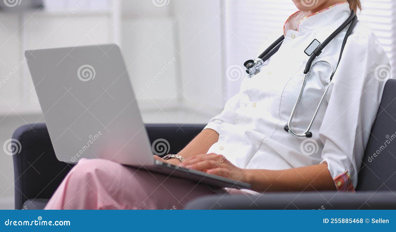 Closeup Portrait of a Young Doctor Sitting on the Sofa Stock Photo ...