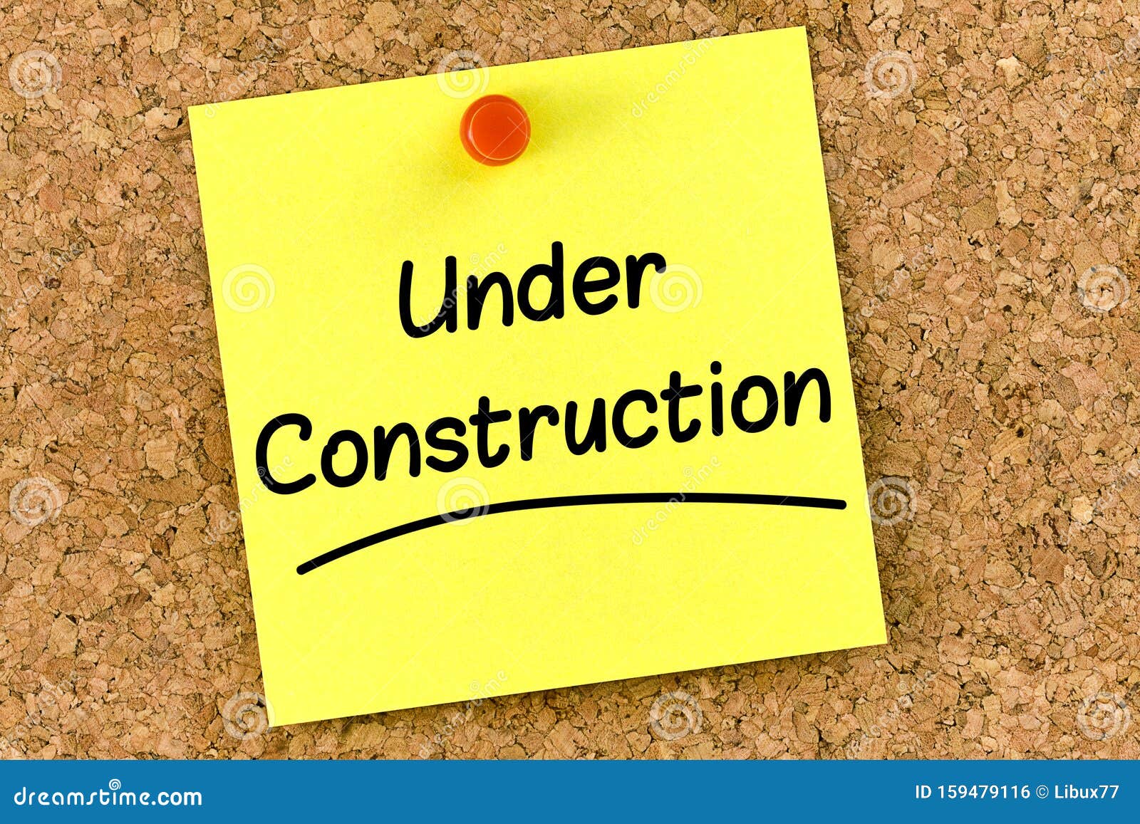 Closeup Post it Note on Corkboard with Under Construction Message on it ...