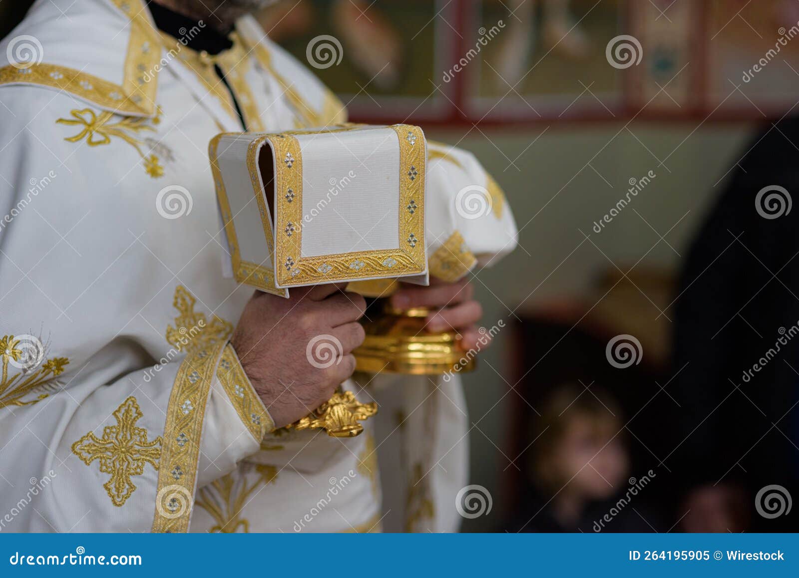 Closeup of a a Priest Holding Golden Goblets during a Ceremony Stock ...