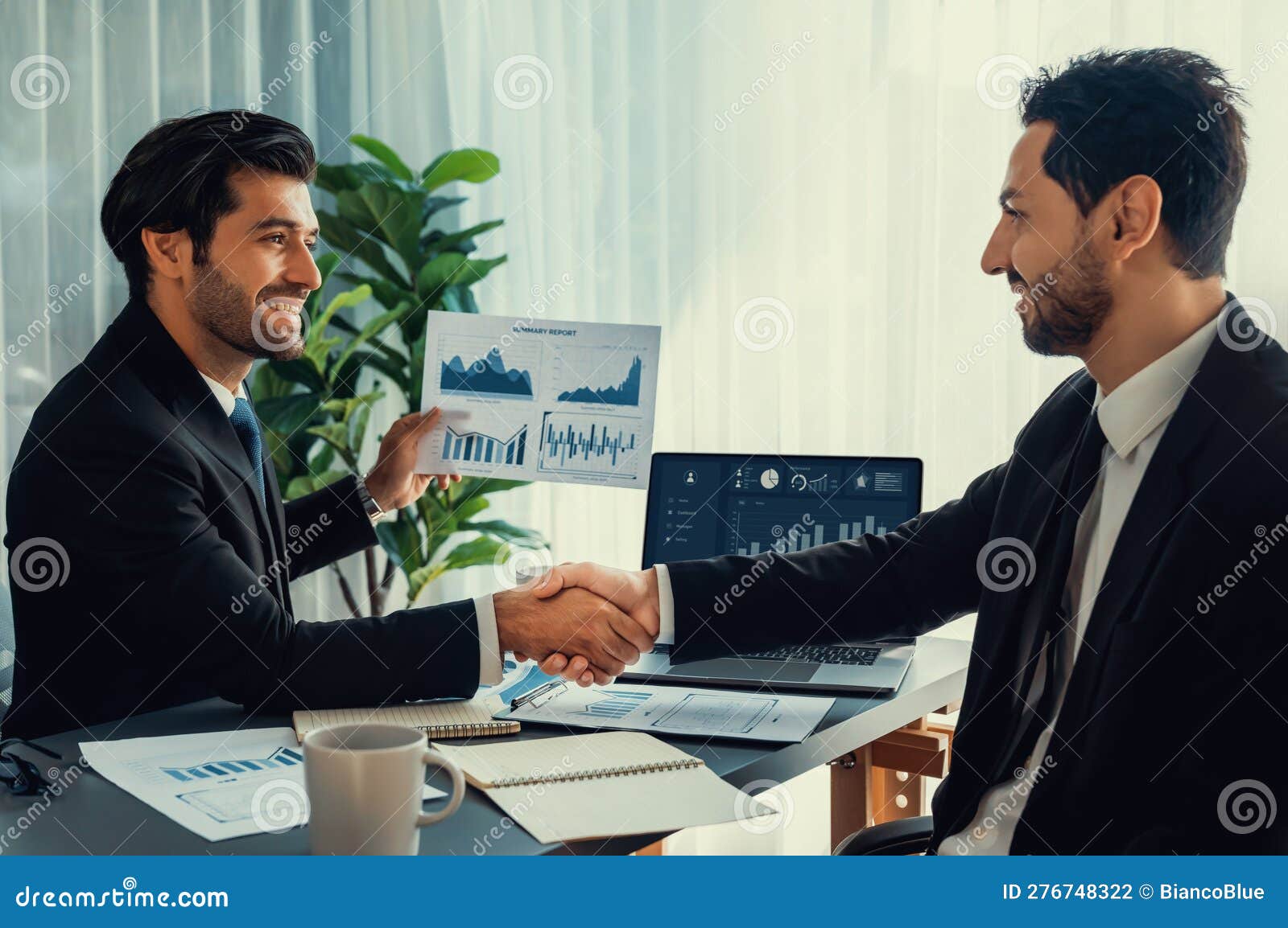 Closeup Businessman Handshake Over Desk with BI Papers. Fervent Stock ...