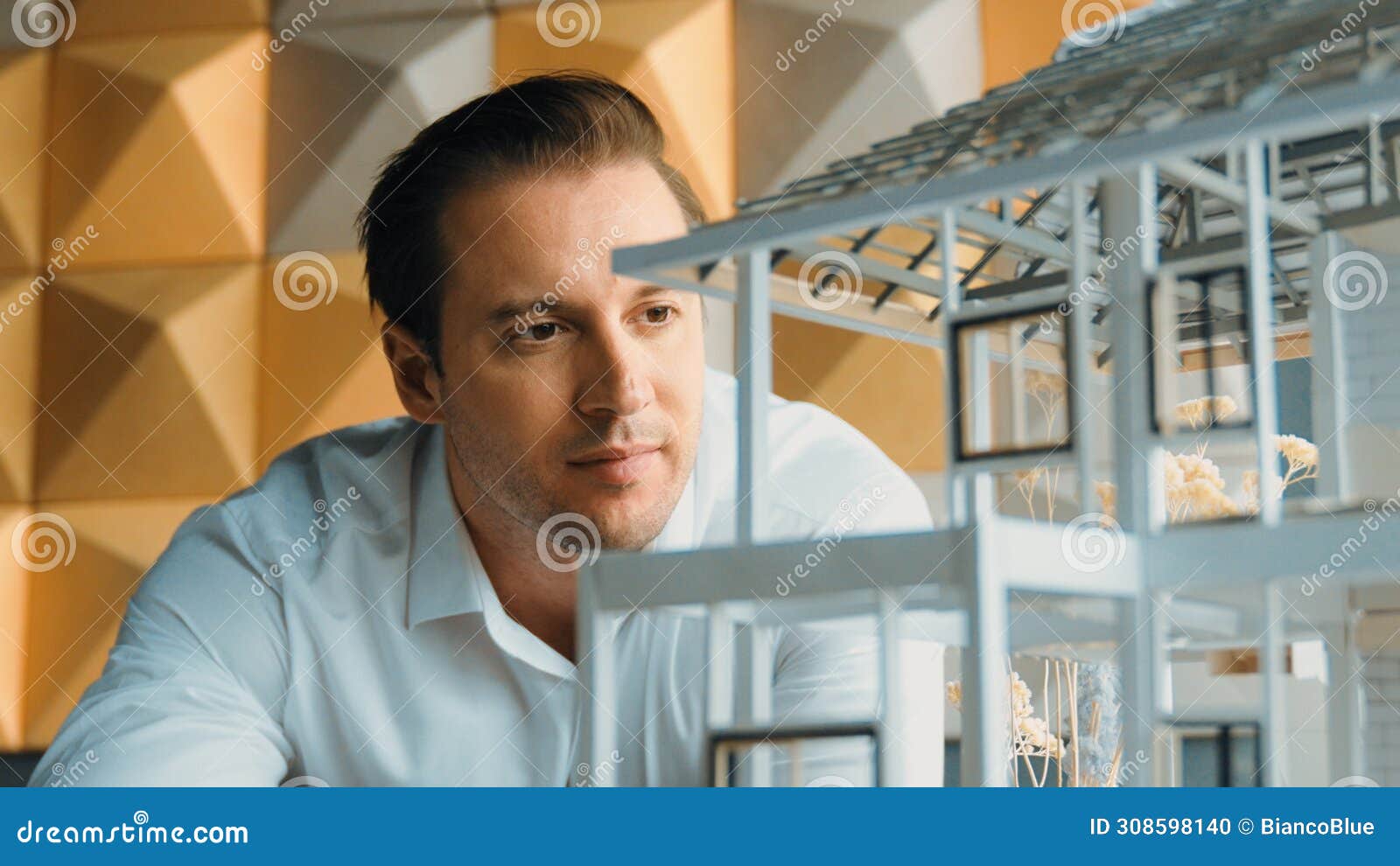 Closeup of Professional Engineer Face Looking at House Model ...