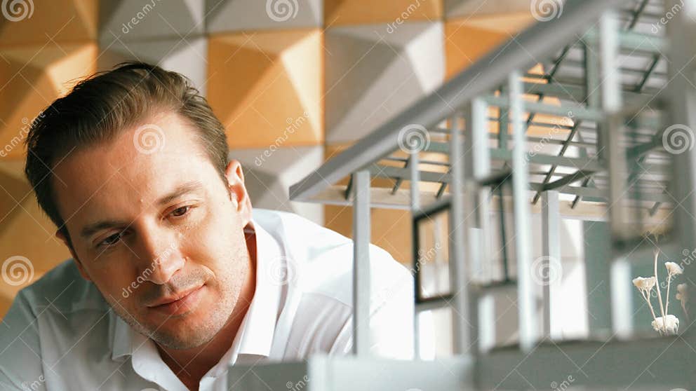 Closeup of Professional Engineer Face Looking at House Model ...
