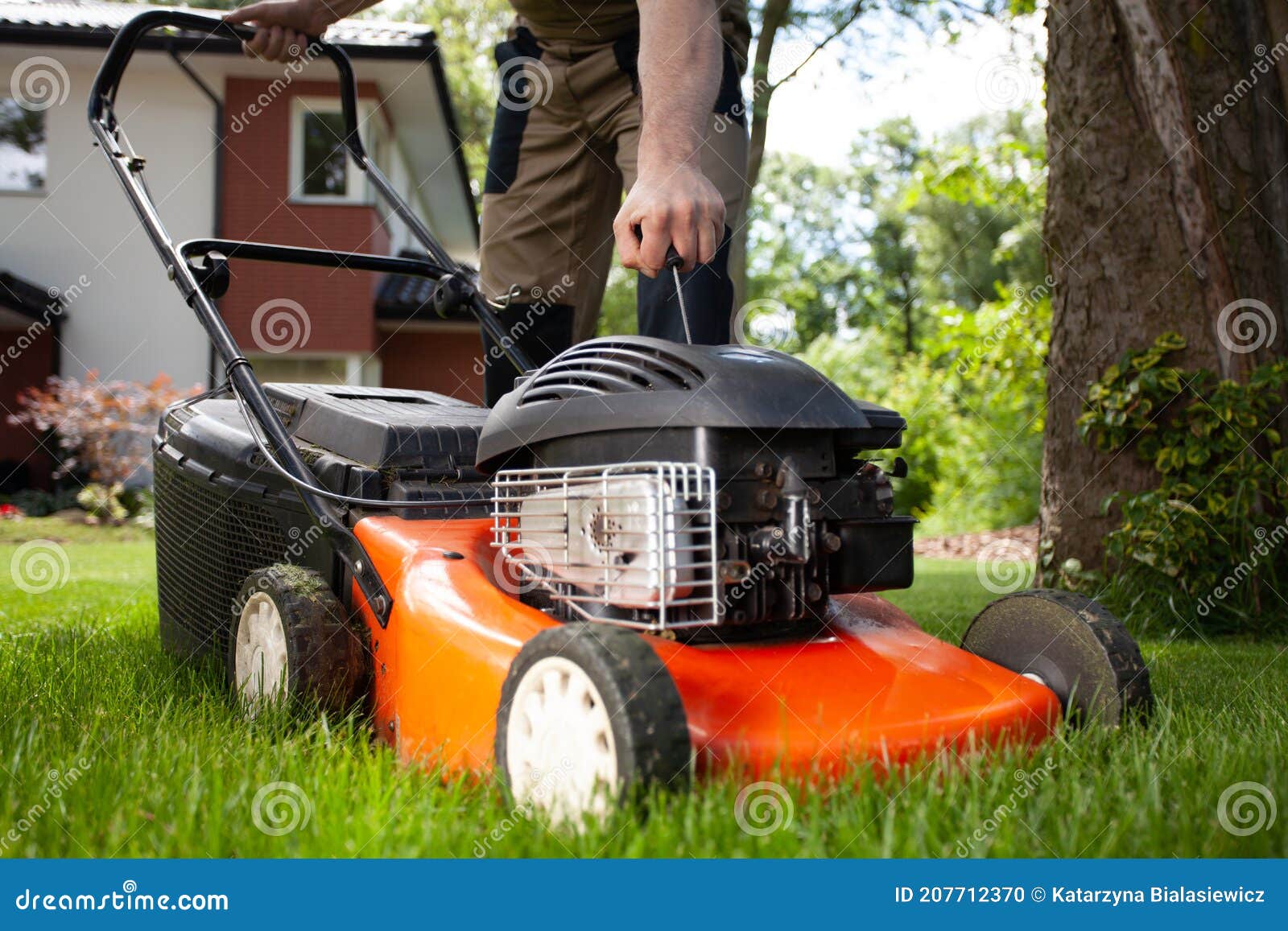 Professional Gardener Turning on the Lawn Mower Stock Photo - Image of ...