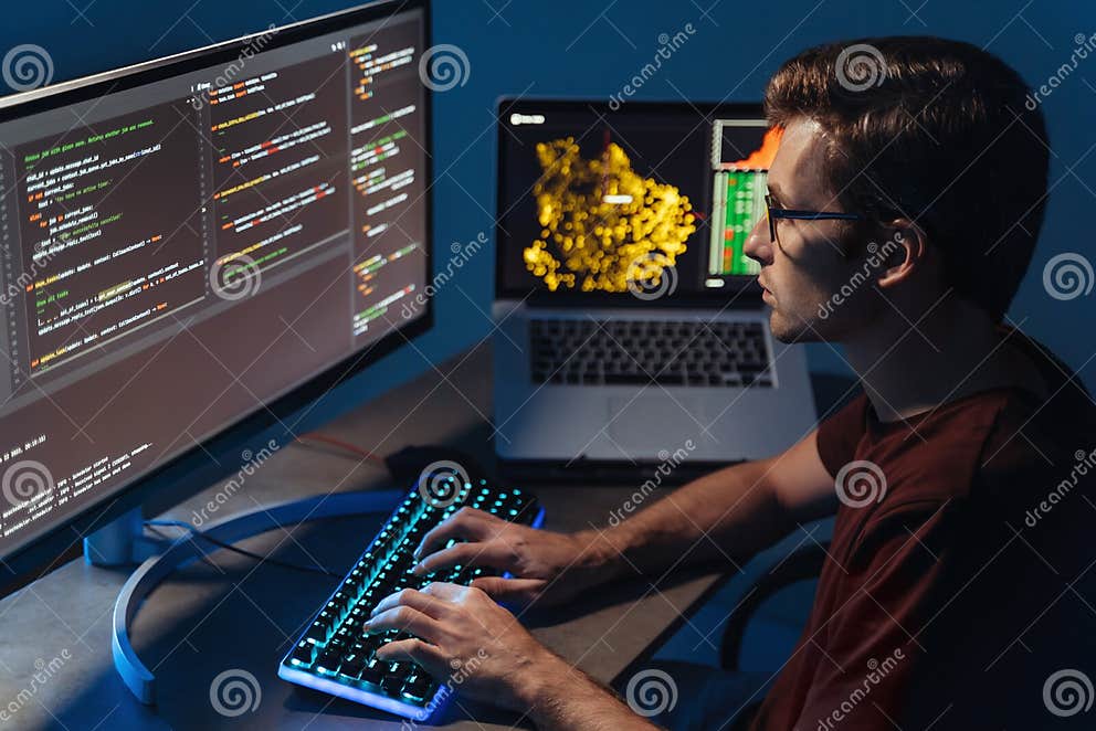 Closeup of Program Developer Writing Software on Multiple Computer ...