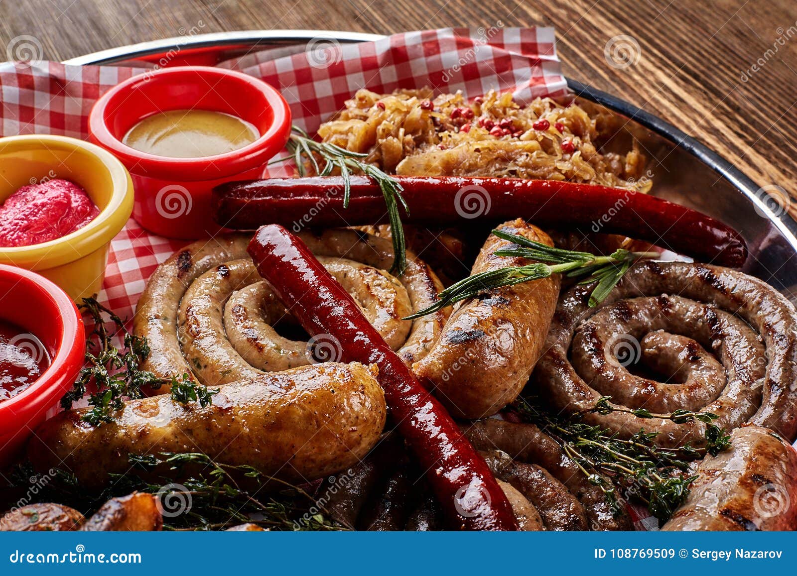 Closeup of Pub Snacks Set. Assorted Chips and Sausages with Red and ...