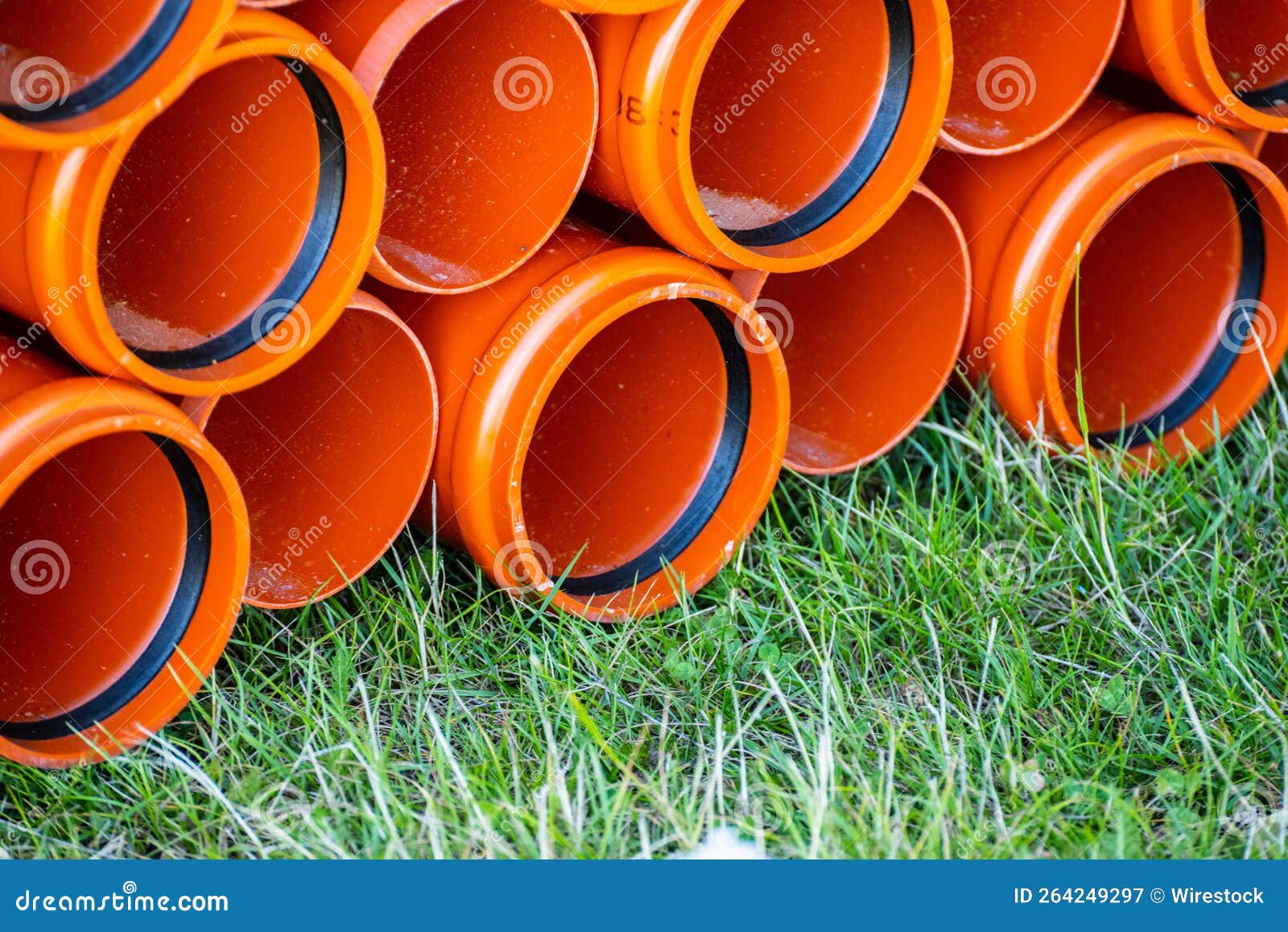 Closeup of Pvc Pipes on a Stack on Green Grass Stock Image - Image of ...