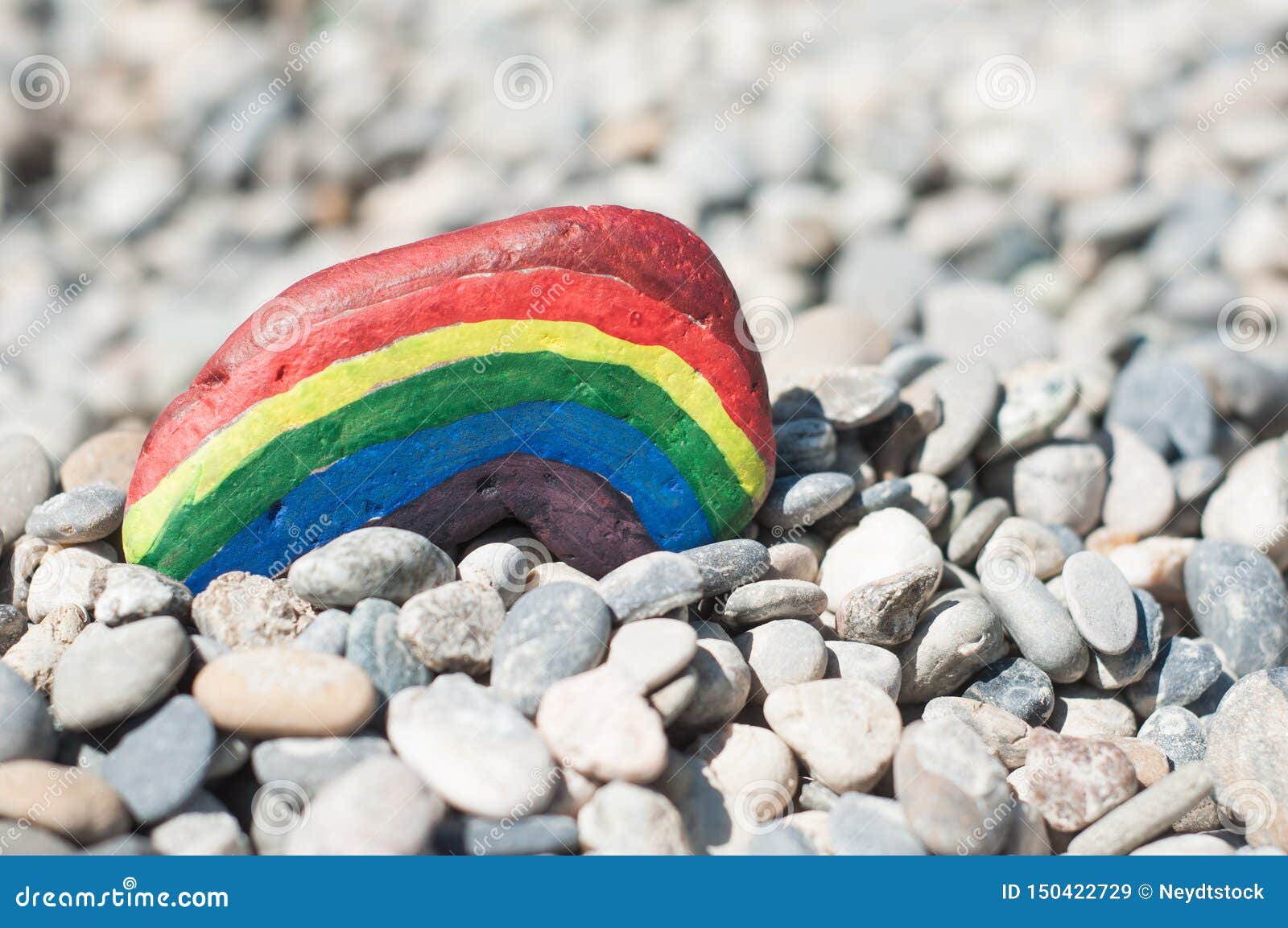 Rainbow Painting on Stone Pebble on Pebble Beach Stock Image - Image of ...