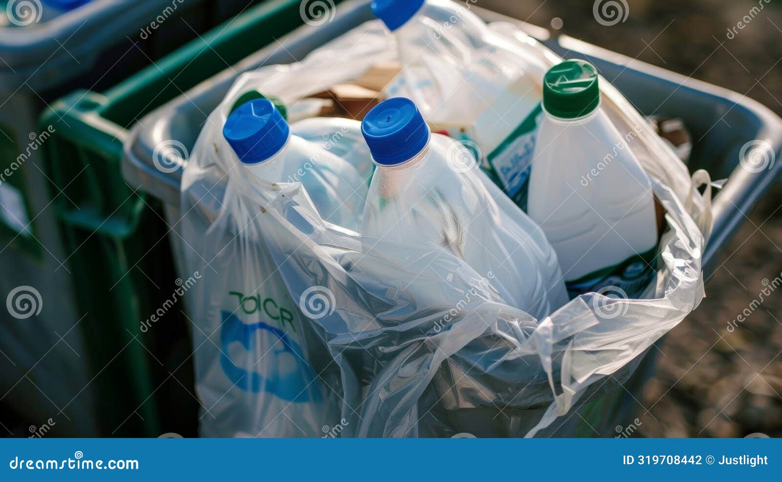 A Closeup of a Recycling Bin with a Clear Plastic Bag Filled with Empty ...