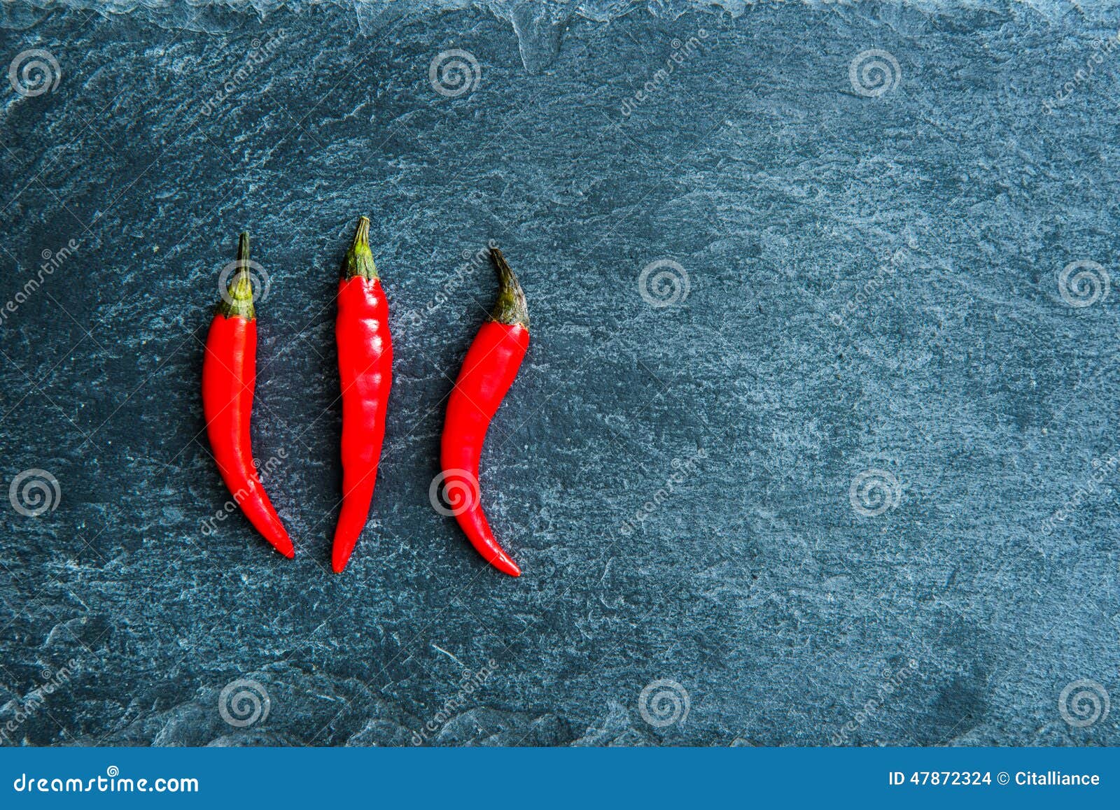 Closeup on Red Chili Peppers on Stone Substrate Stock Photo - Image of ...