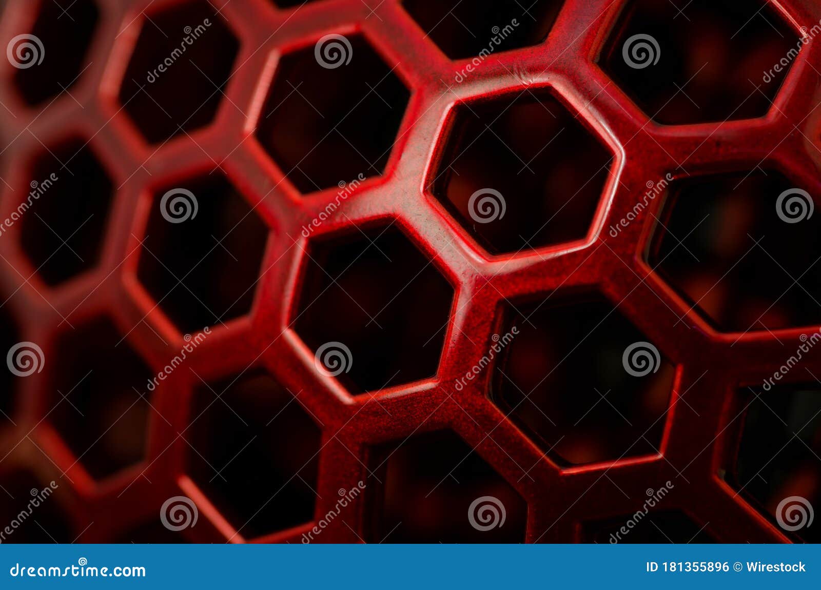 Closeup of a Red Pattern with Hexagon Holes Stock Photo - Image of dark ...