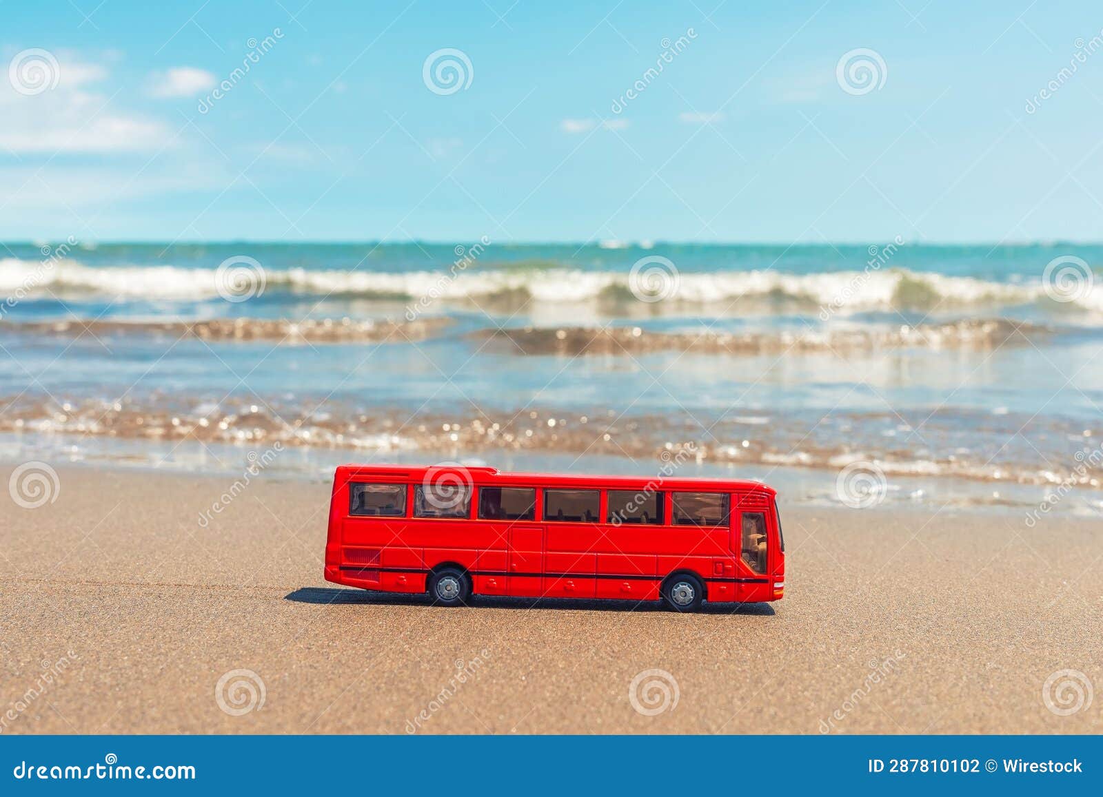 Closeup of a Red Toy Bus on the Sandy Beach Stock Photo - Image of ...