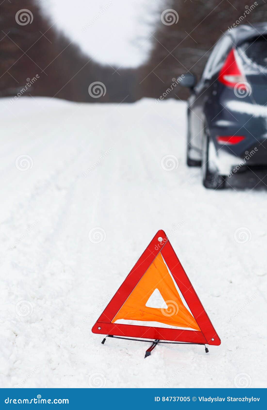 Closeup of Red Warning Triangle with a Broken Down Car Stock Image ...