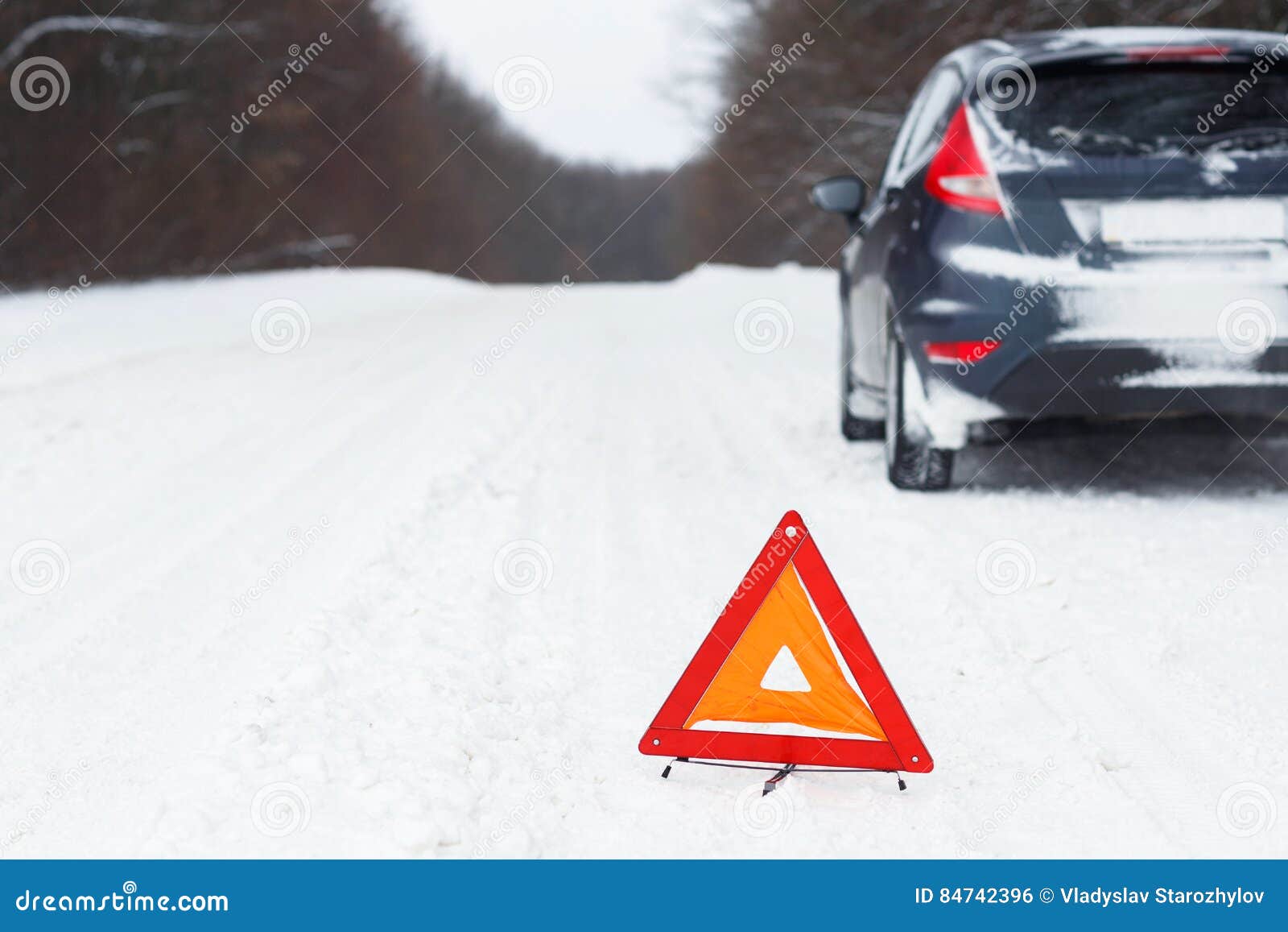 Closeup of Red Warning Triangle with a Broken Down Car Stock Photo ...