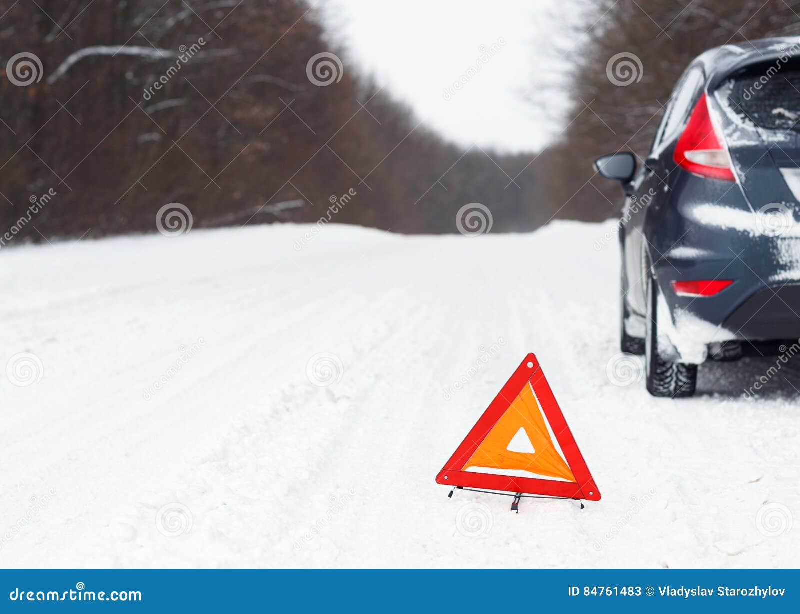 Closeup of Red Warning Triangle with a Broken Down Car Stock Image ...