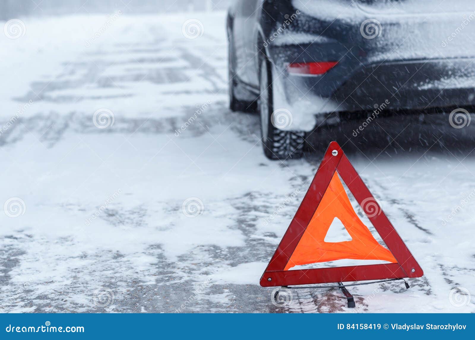 Closeup of Red Warning Triangle with a Broken Down Car in Winter Stock ...