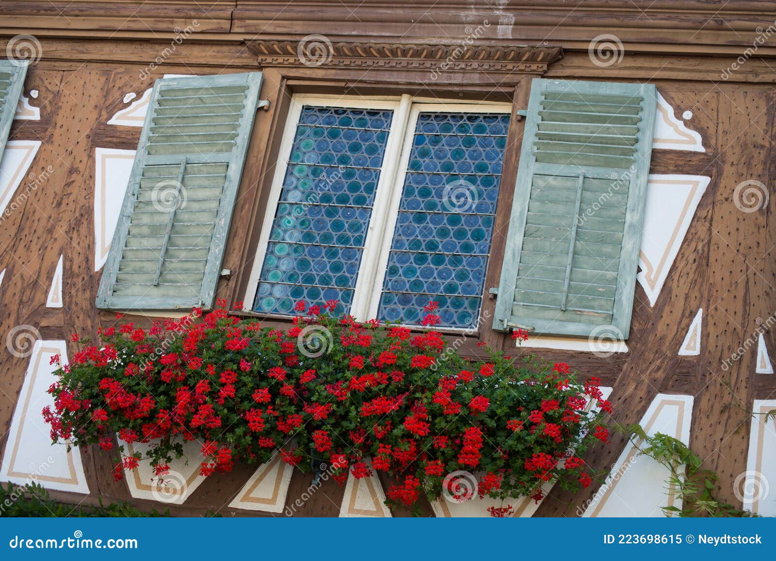 Red Geraniums on Medieval Building Facade in Te Street Stock Image ...
