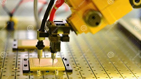 Closeup of a Robotic Arm Delicately Placing Semiconductor Chips Onto a ...