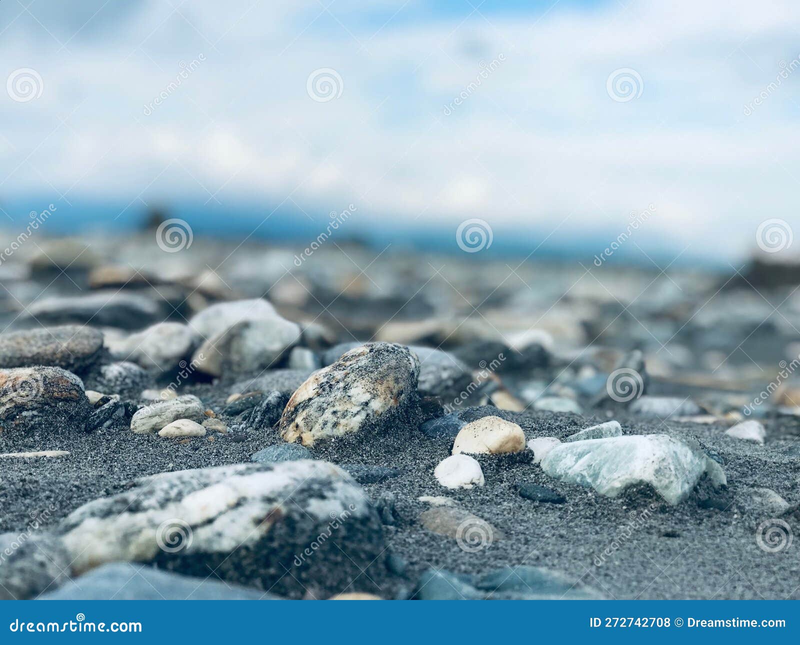 Closeup of a Rocky Beach Next To the Ocean Stock Photo - Image of ...