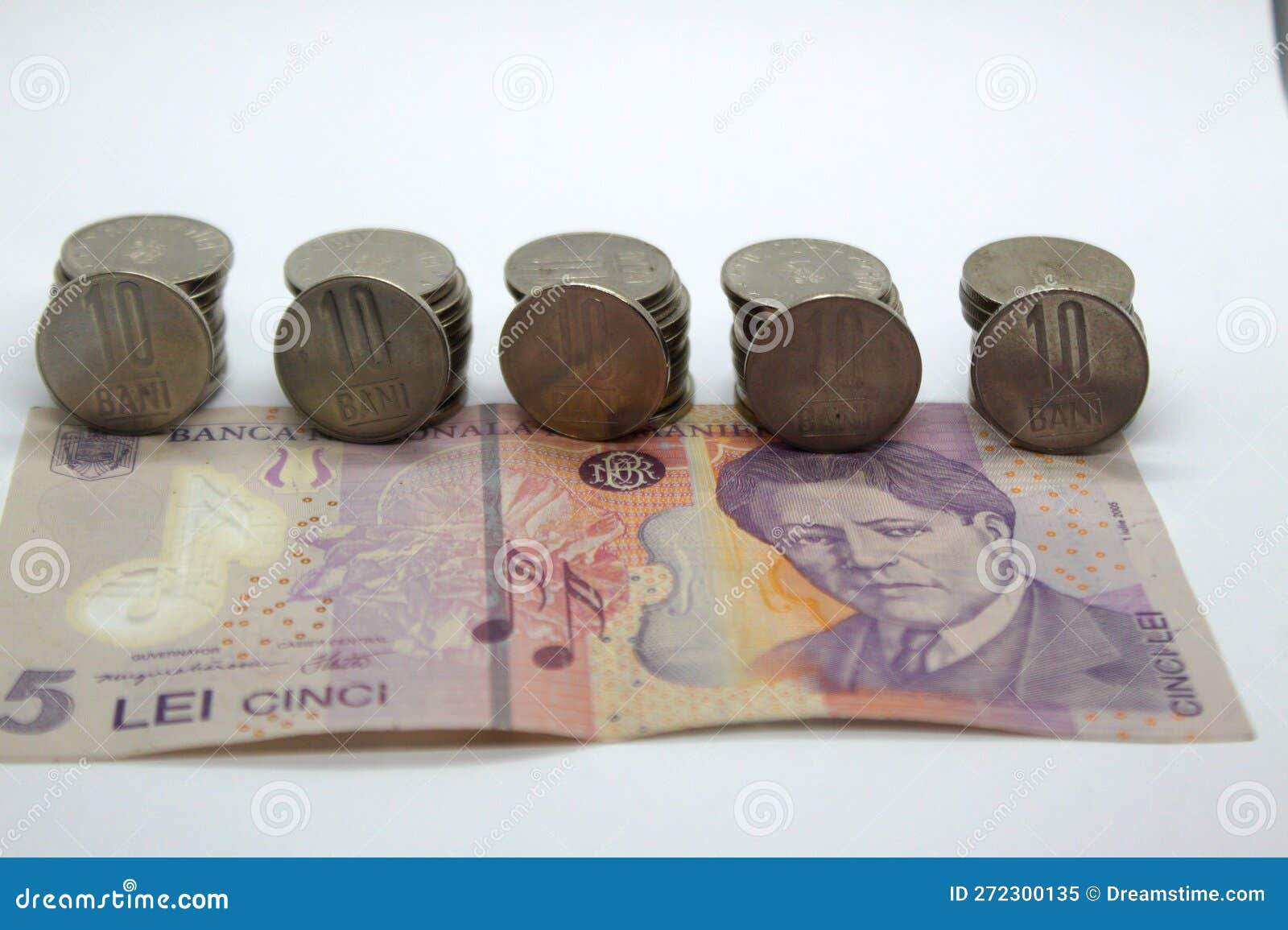 Closeup of Romanian Currency Stack of 10 Bani Coins on 5 Lei Banknote ...