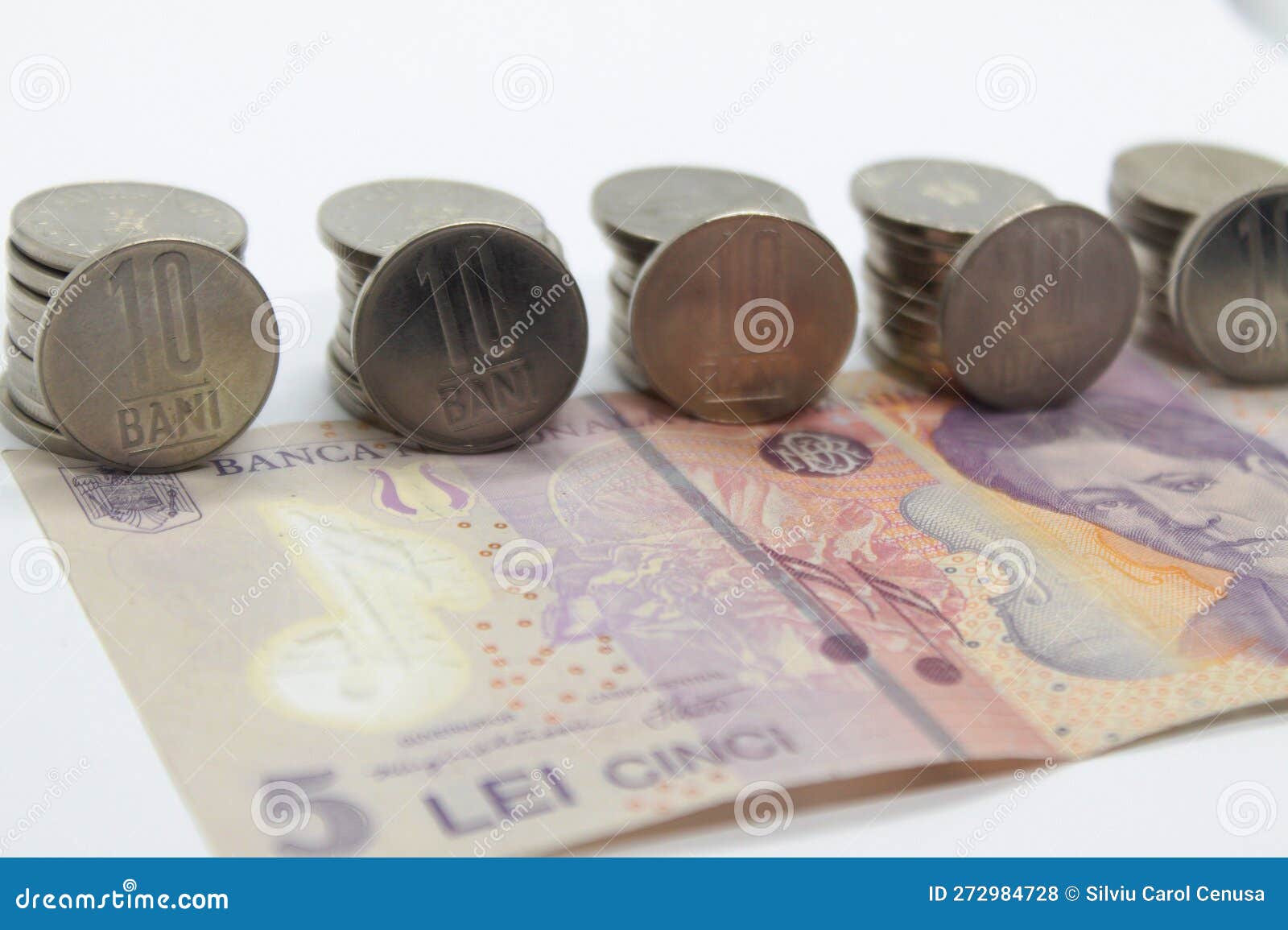 Closeup of Romanian Currency Stack of 10 Bani Coins on a 5 Lei Banknote ...