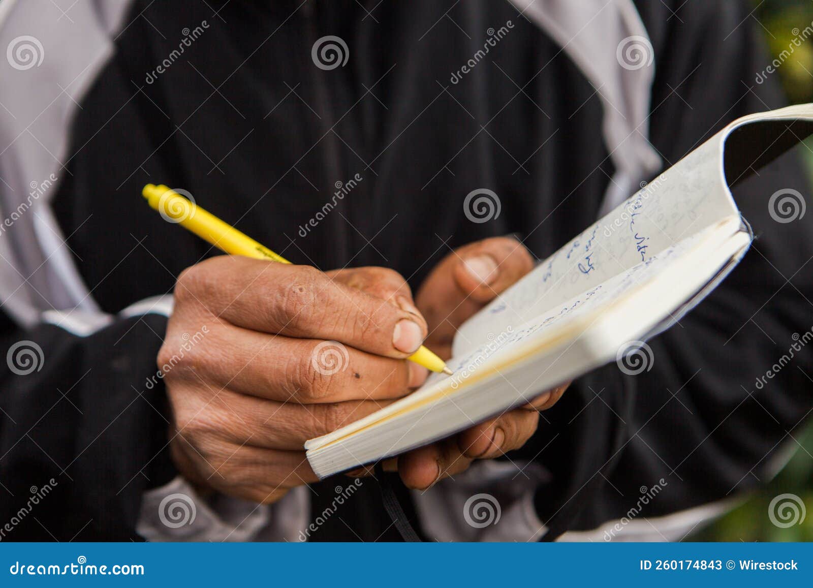 Closeup of Rough Hands Taking Notes with Yellow Pen Stock Image - Image ...