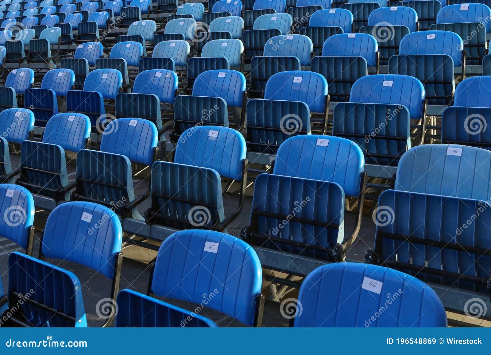 Closeup of Rows of Blue Folded Chairs at a Stadium Stock Image - Image ...