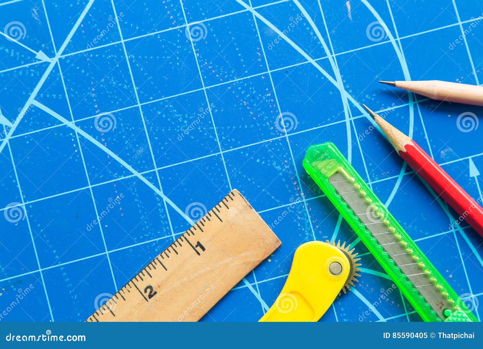 Closeup of Ruler,scissors, Cutter, Pencil on Blue Cutting Mat Stock ...