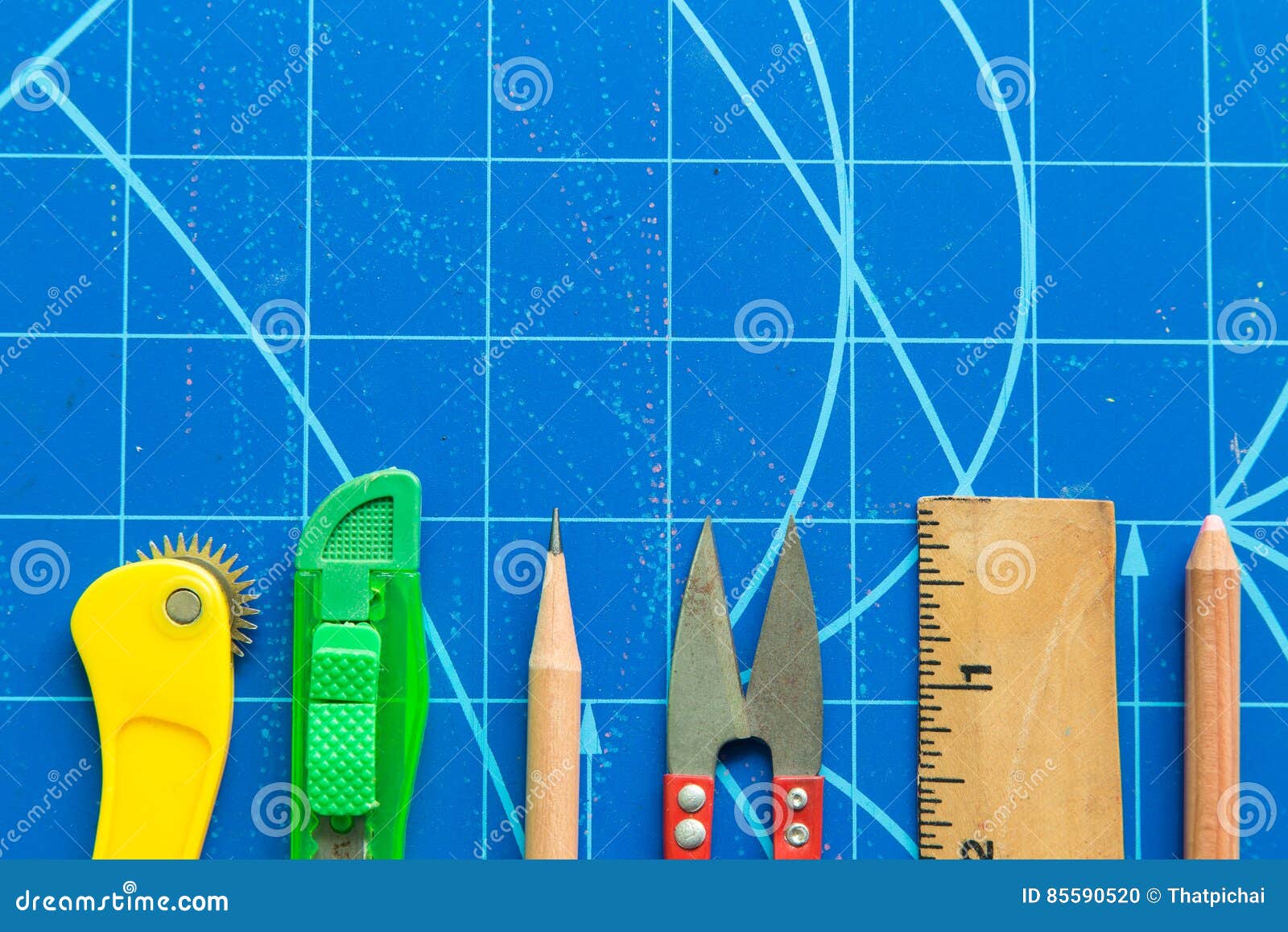 Closeup of Ruler,scissors, Cutter, Pencil on Blue Cutting Mat Stock ...