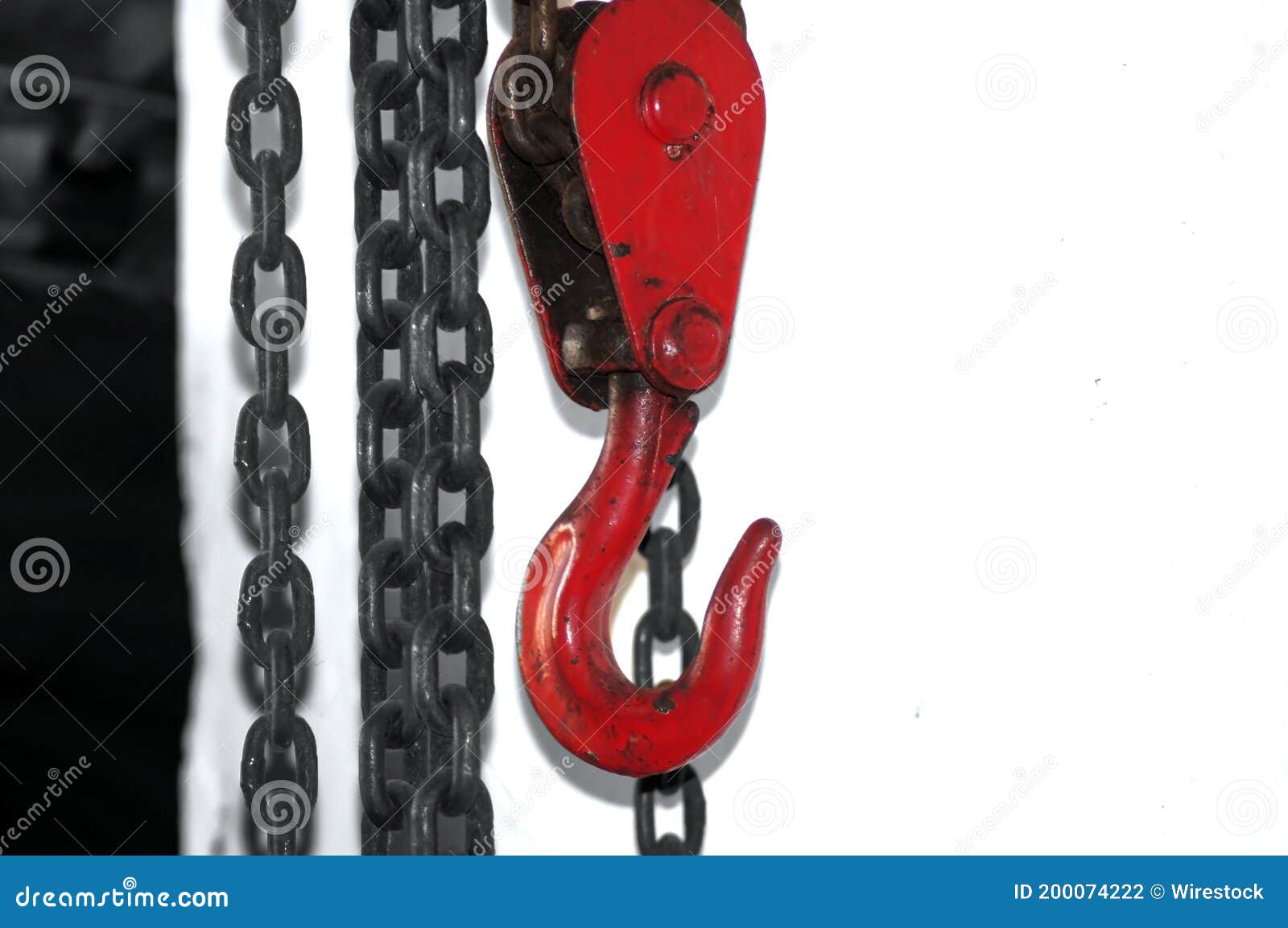 Closeup of the Rusty Cable Chain Hoist of a Crane Under the Lights ...