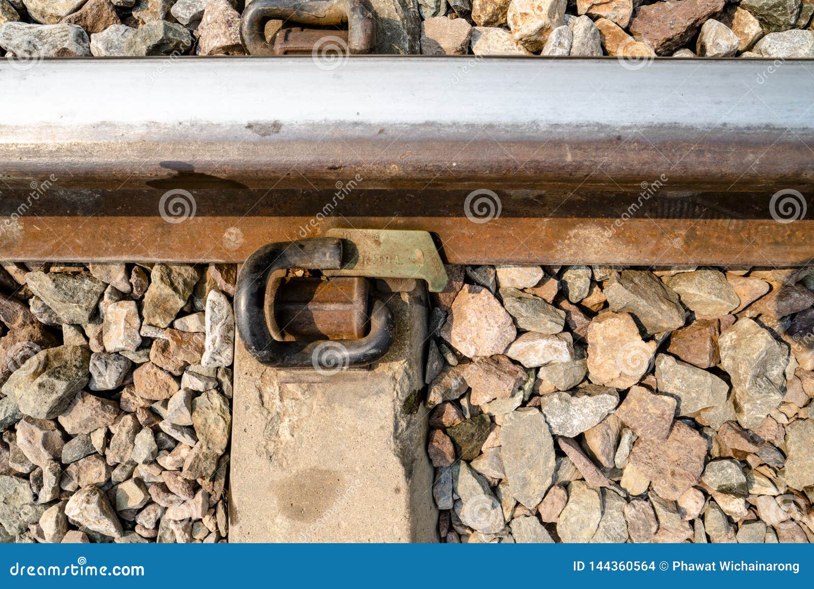 Closeup of Rusty Iron Train Track with Railroad Tie and Pebbles. Stock ...