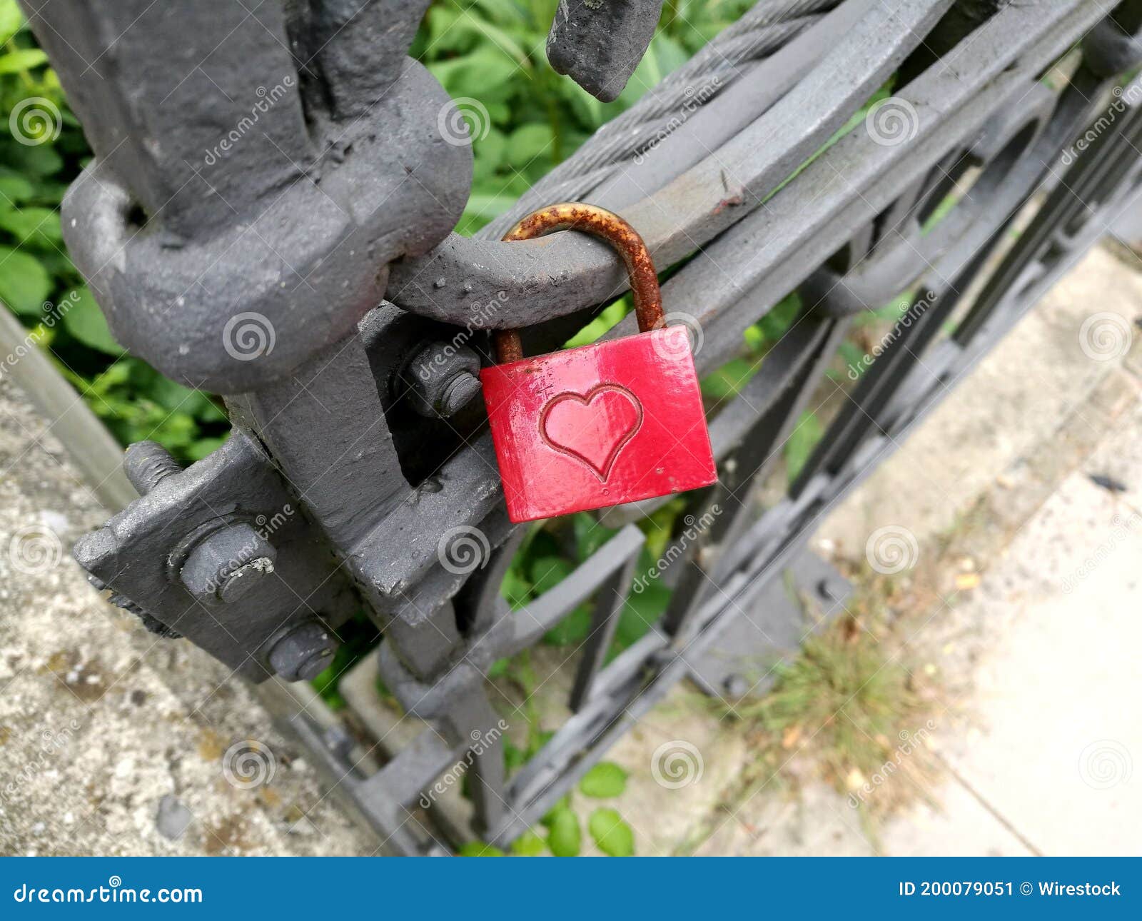 Closeup of a Rusty Red-painted Fortune Lock with a Heart on the Railing ...
