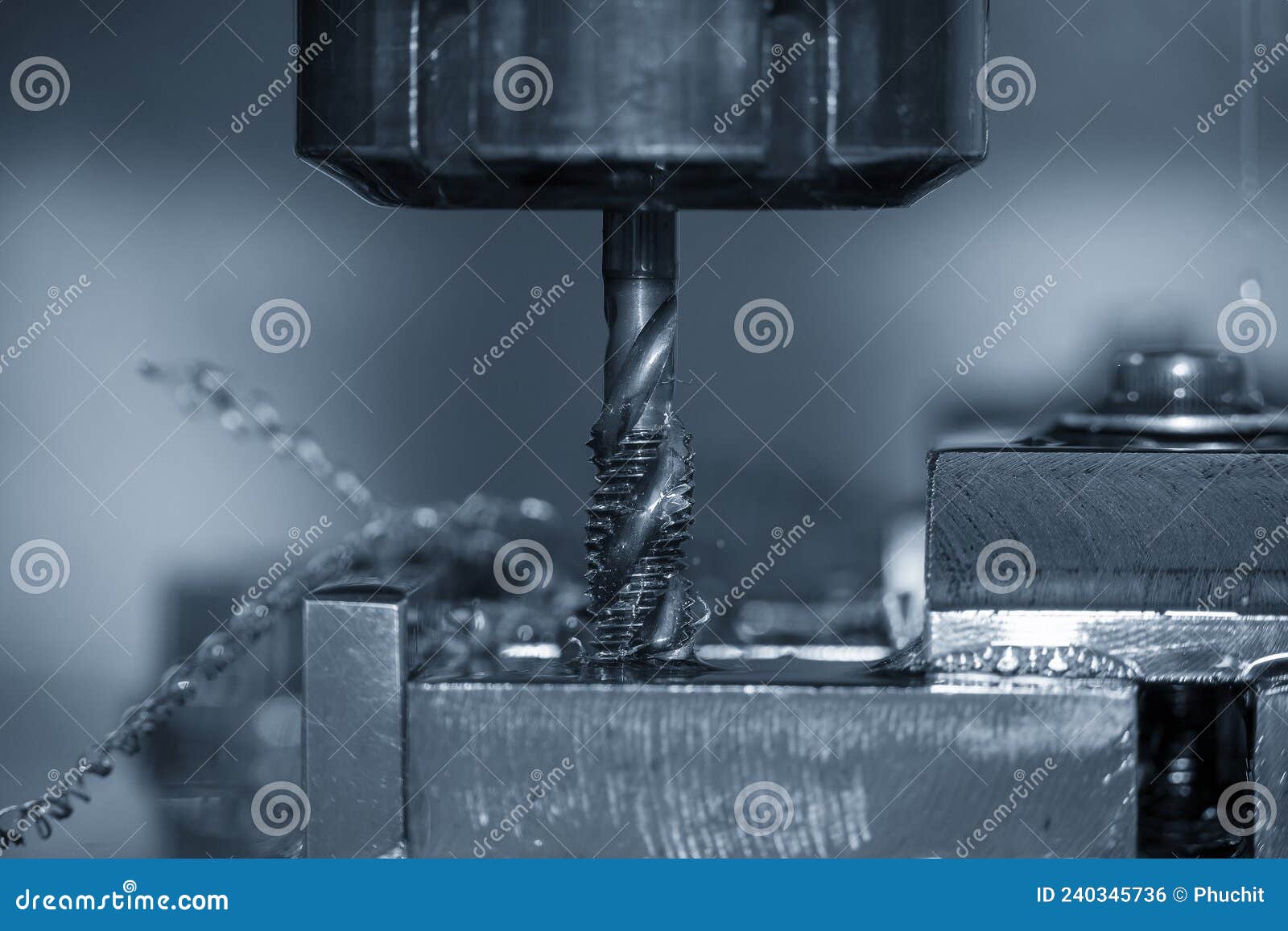 The Closeup Scene of Machine Tapping Process on CNC Machine Stock Photo ...