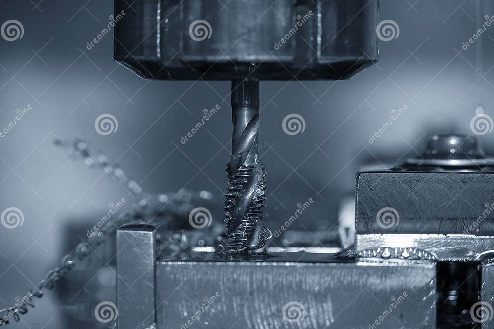 The Closeup Scene of Machine Tapping Process on CNC Machine Stock Photo ...