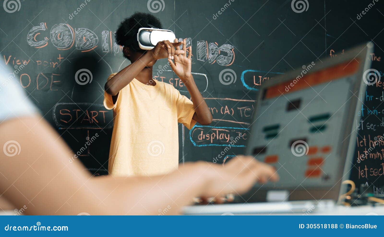 Closeup of School Girl Hand Coding Program while Student Using VR ...