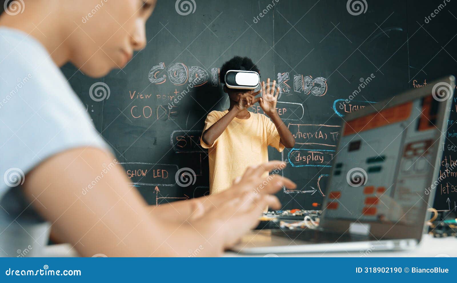 Closeup of School Girl Hand Coding Program while Student Using VR ...