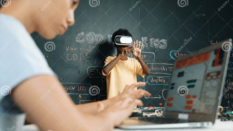 Closeup of School Girl Hand Coding Program while Student Using VR ...