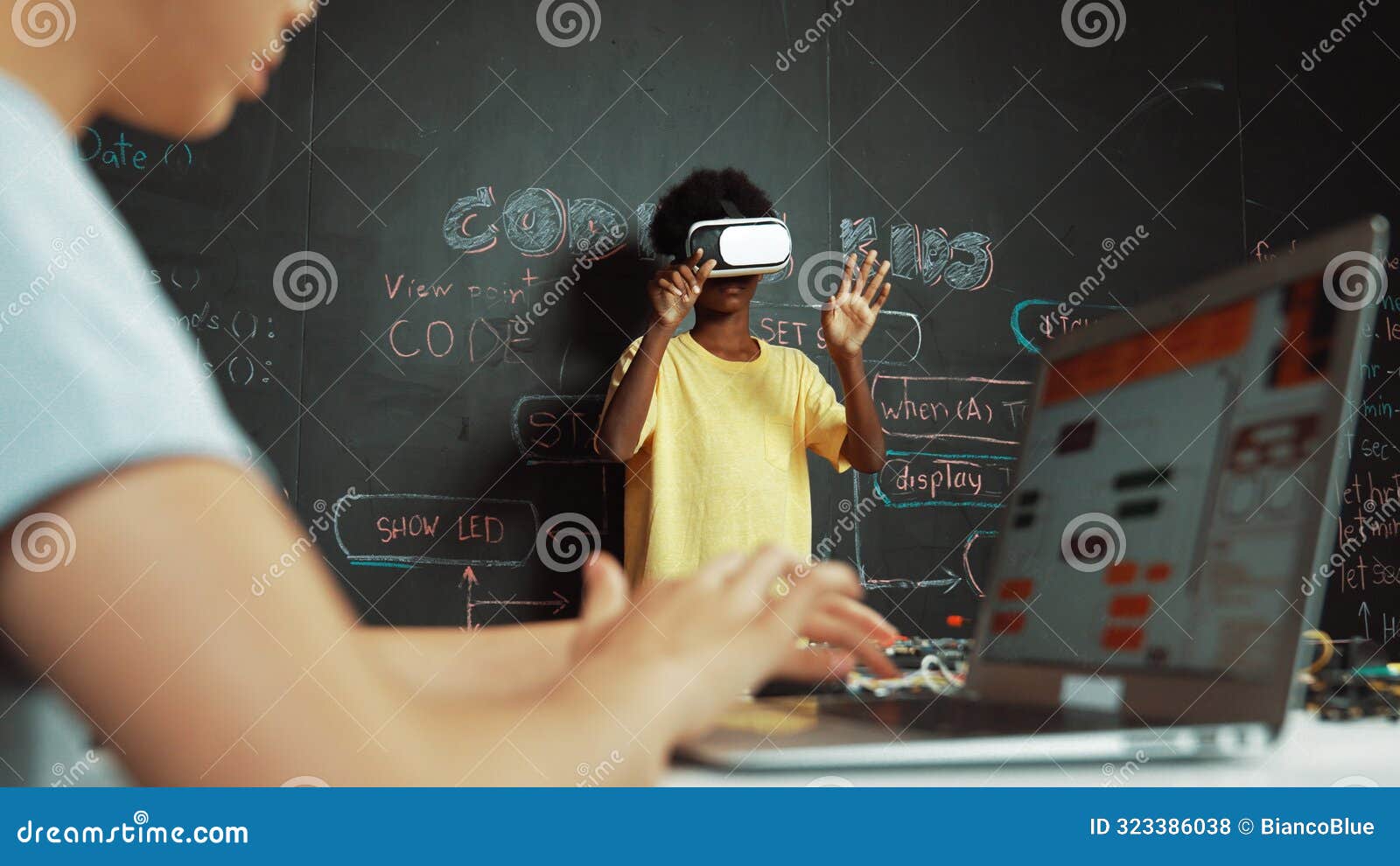 Closeup of School Girl Hand Coding Program while Student Using VR ...