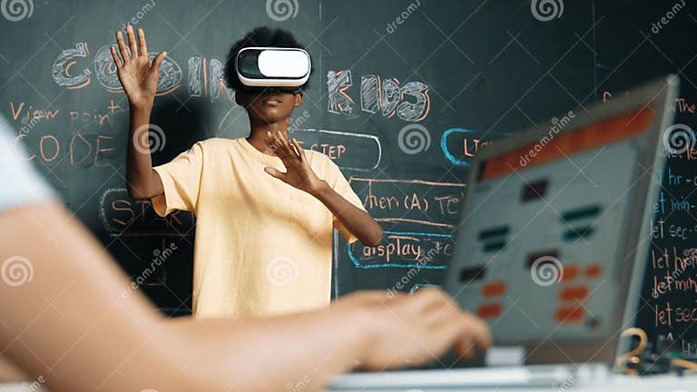 Closeup of School Girl Hand Coding Program while Student Using VR ...