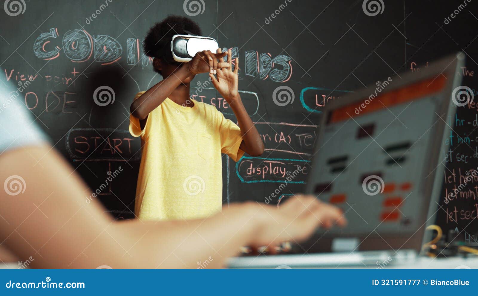 Closeup of School Girl Hand Coding Program while Student Using VR ...