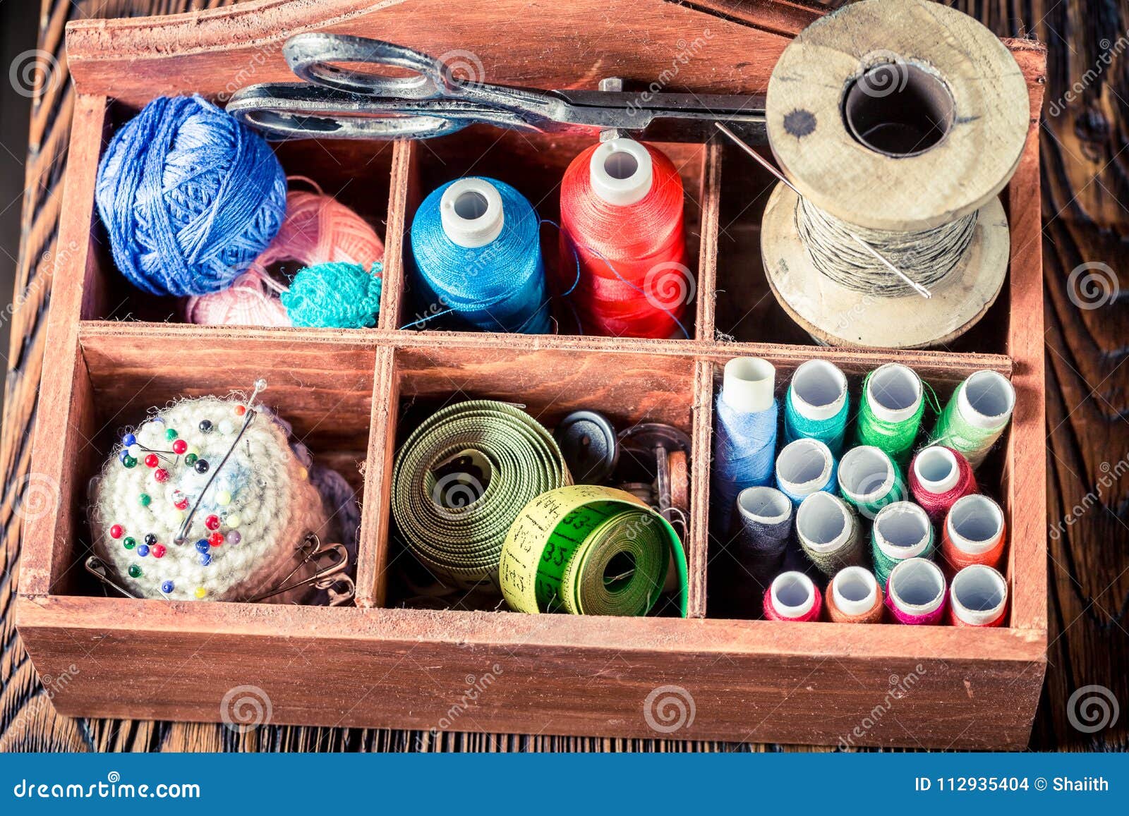 Closeup of Scissors, Needle and Threads in Wooden Box Stock Photo ...