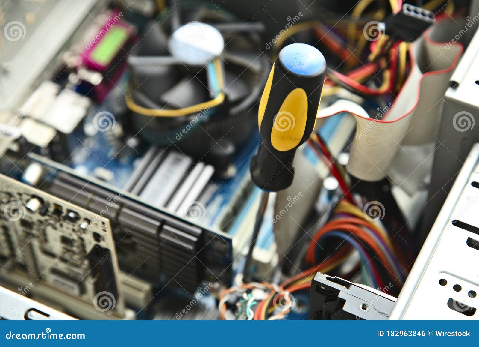 Closeup of a Screwdriver on the Computer Components in an Open Case ...
