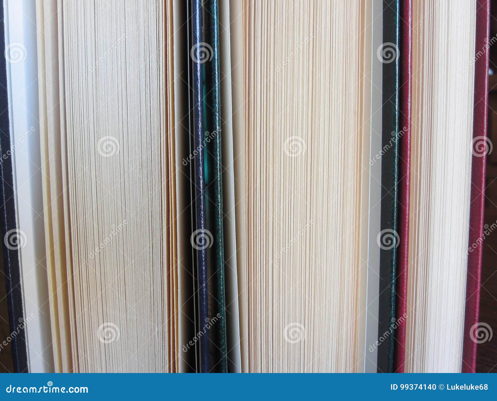 Closeup of Second Hand Books Standing on a Wooden Table . Front View ...