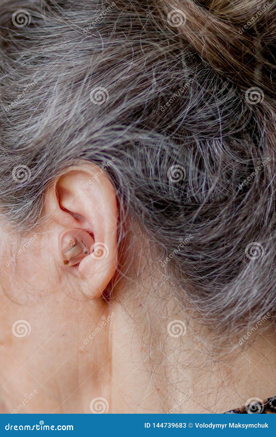 Closeup Senior Woman Inserting Hearing Aid in Her Ears Stock Image ... Closeup Senior Woman Inserting Hearing Aid in Her Ears Stock Image ...
