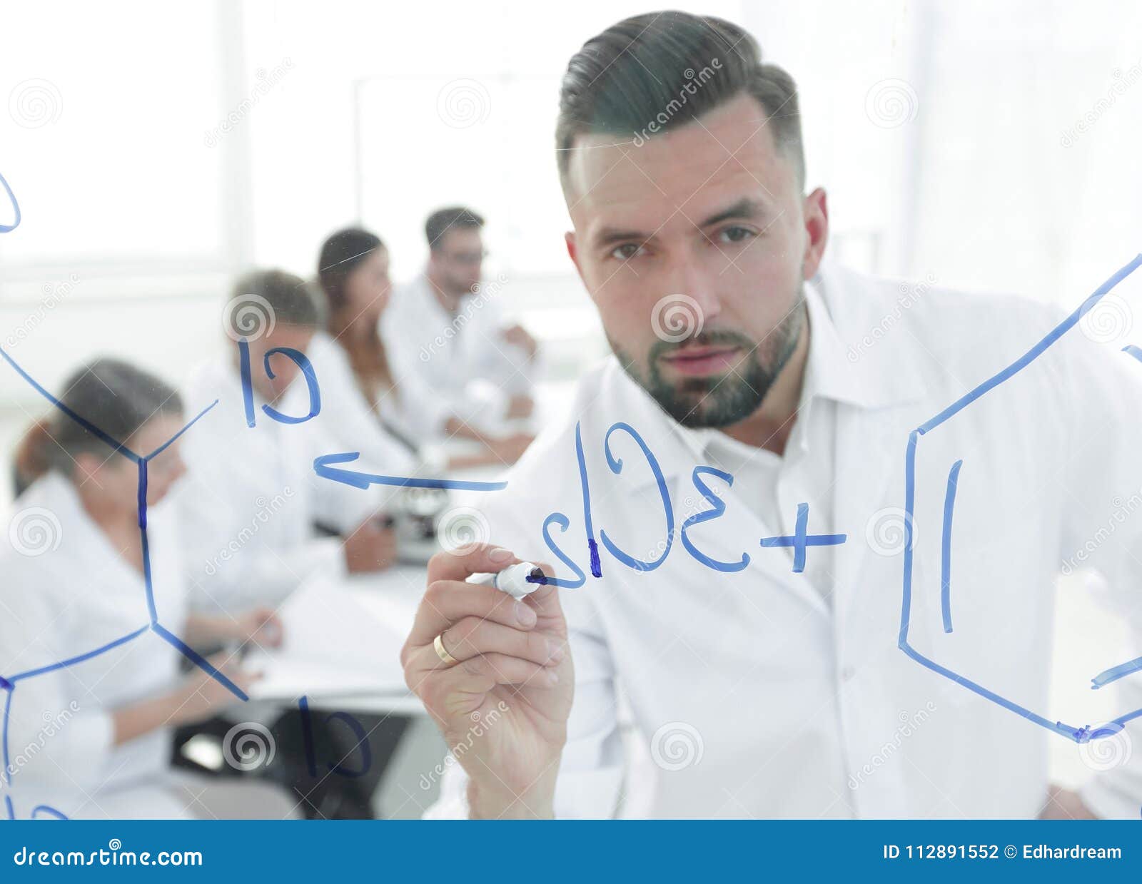 Closeup of a Serious Scientist Working with Formulas Stock Photo ...