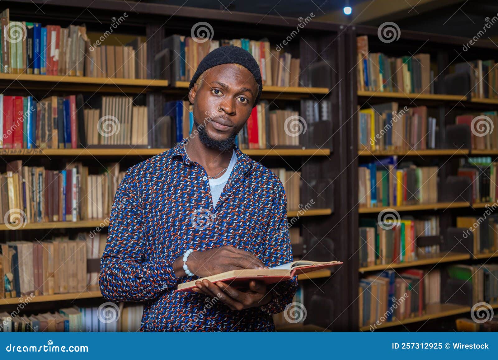 Closeup Shot of an African Boy Reading a Book in the Library Stock ...