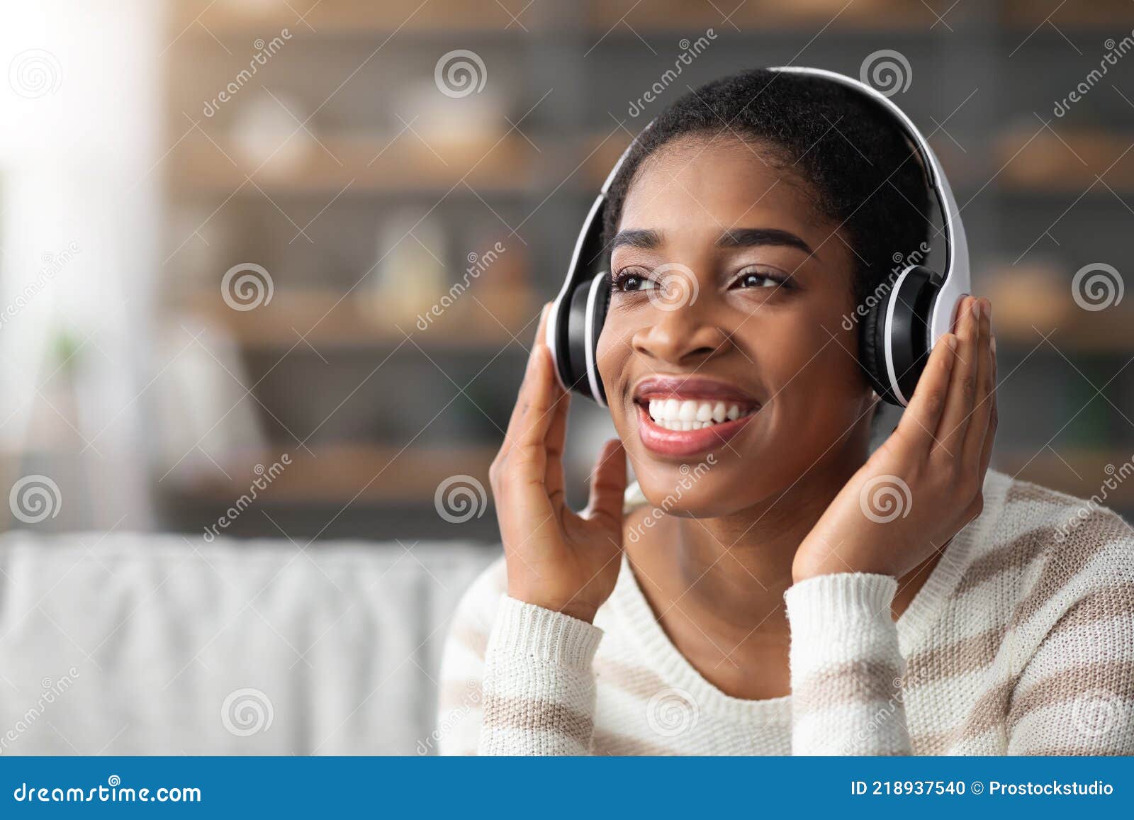 Closeup Shot Of Beautiful Black Woman Listening Music In Wireless